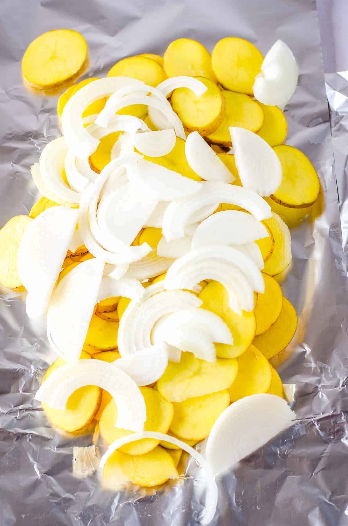 Grilled Foil Packet Potatoes with Onions! - Gimme Some Grilling