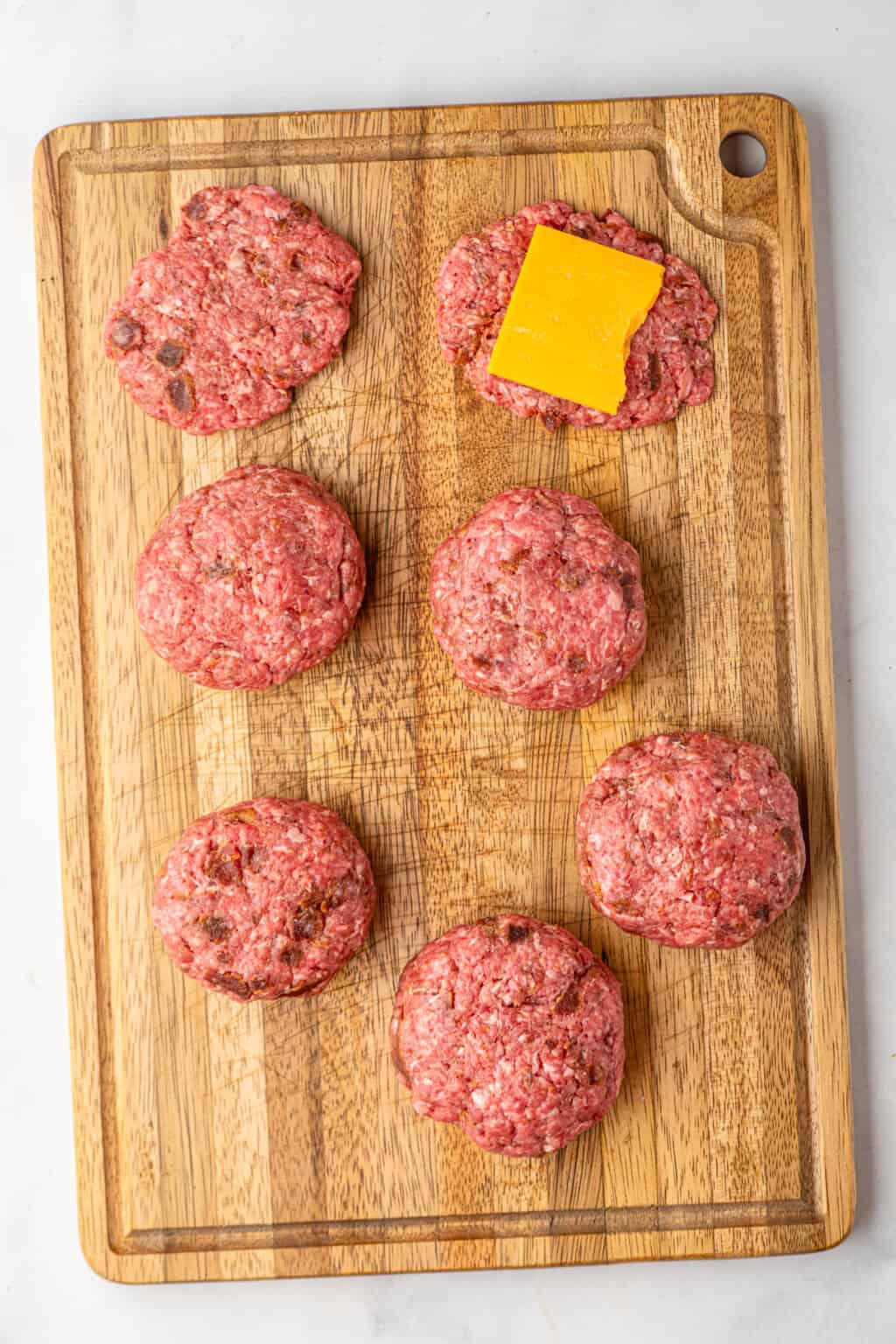 The Easiest Stuffed Bacon Cheeseburgers Recipe - Gimme Some Grilling